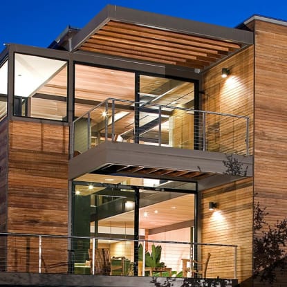 Living Room with Laminate Flooring by Constructive Builders