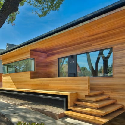 Exterior Entryway with Shiplap Wood Siding by Constructive Builders