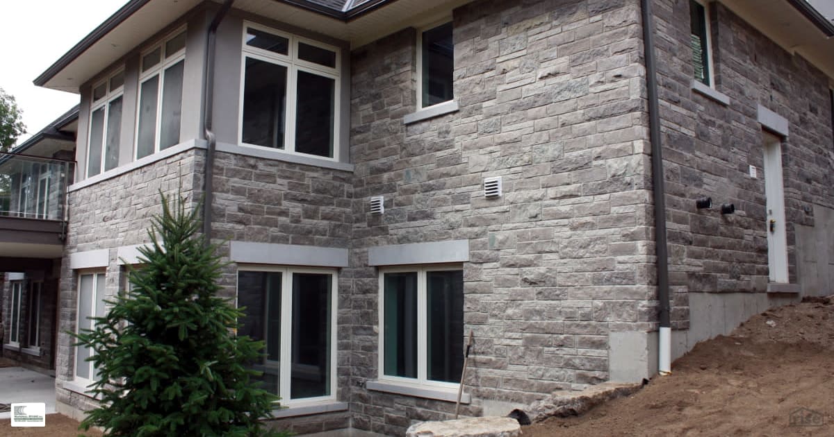 Rear exterior with stone siding with Stone Siding by Masonal Stone Inc