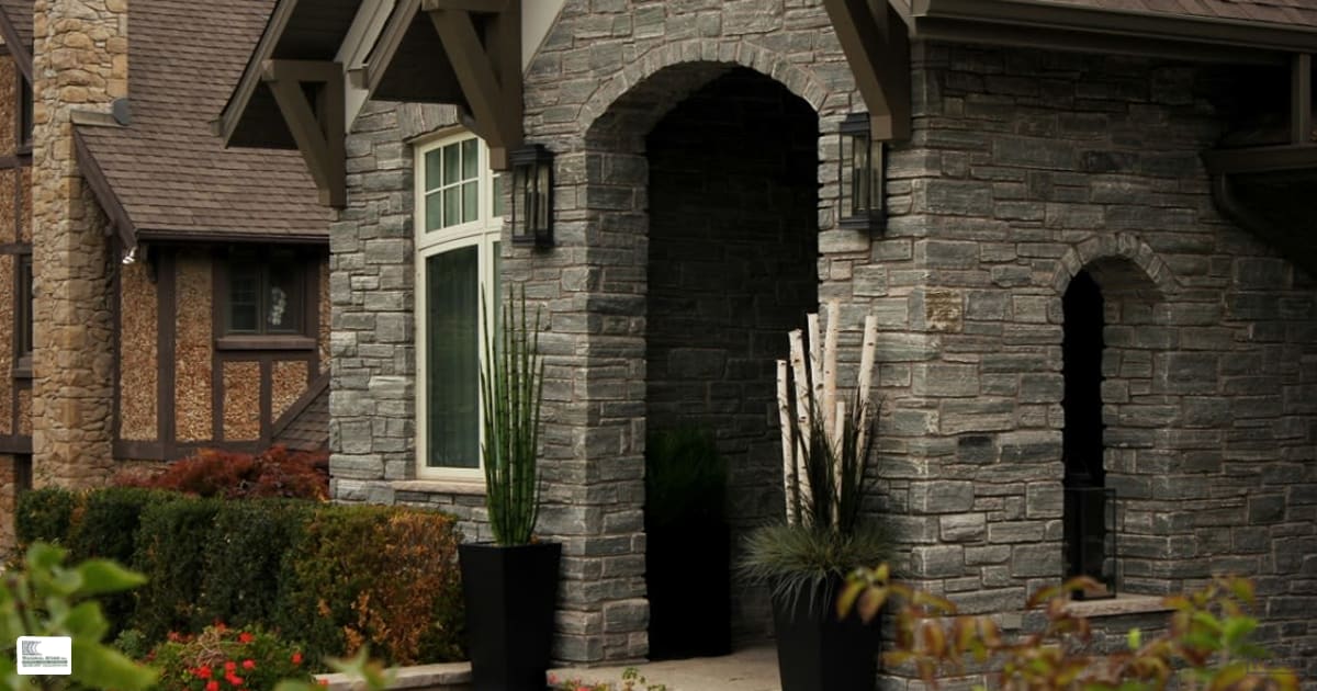 Stone arch entryway with Accent Outdoor Lighting by Masonal Stone Inc