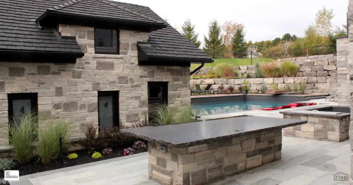 House with stone siding and pool with Stone Siding by Masonal Stone Inc