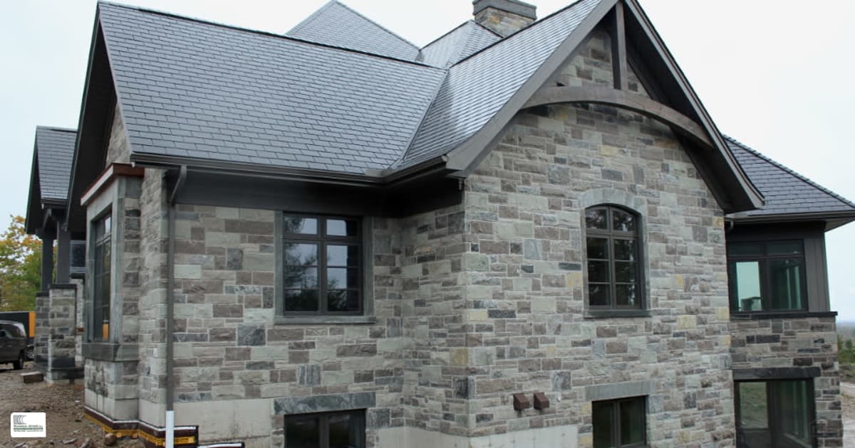 Stone house with synthetic slate roof with Stone Siding by Masonal ...