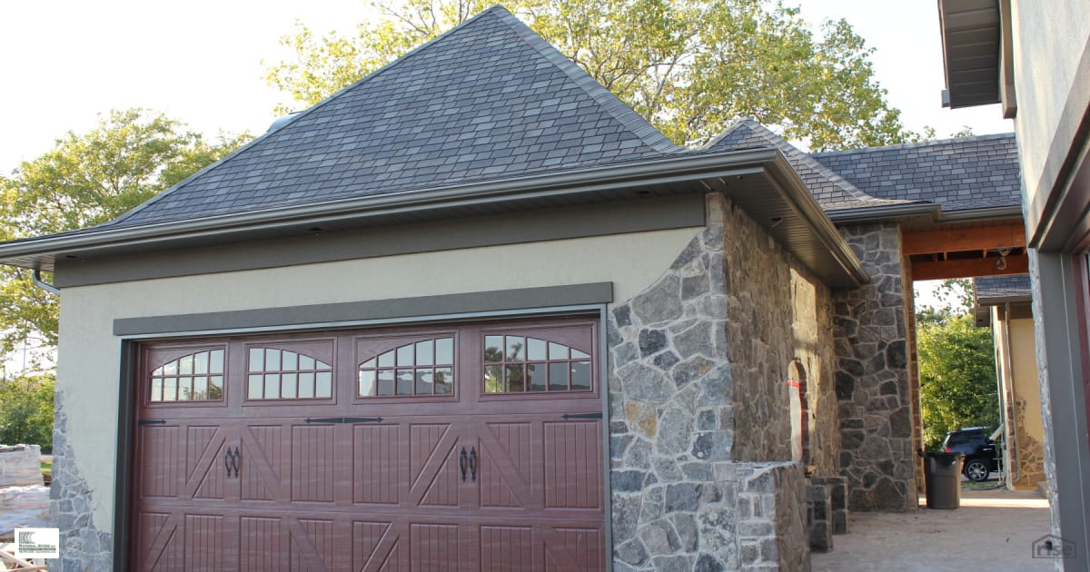 Garage with stone siding with Stone Siding by Masonal Stone Inc