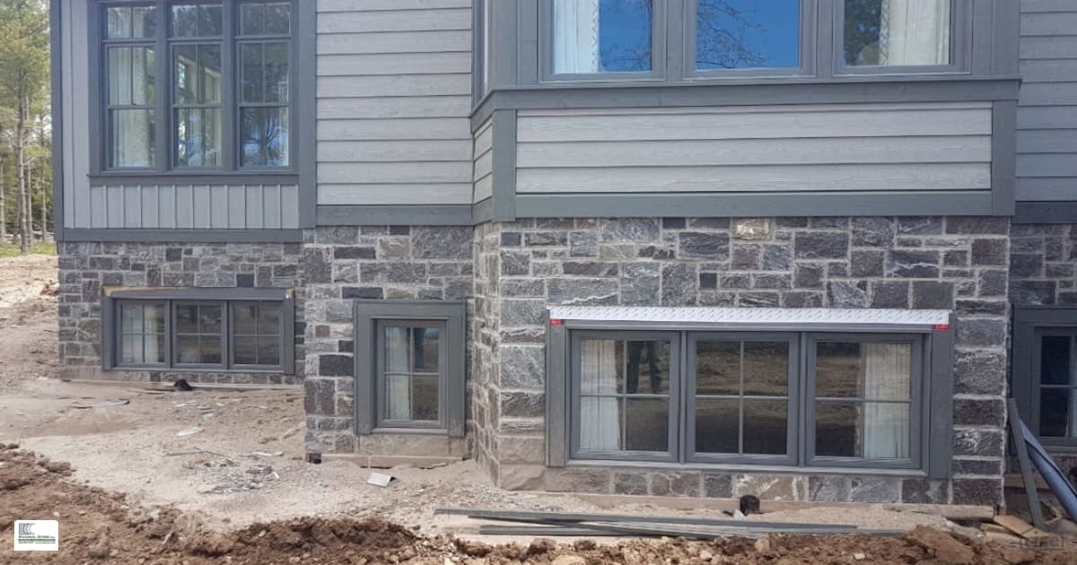 Stone siding accented by composite with Stone Siding by Masonal Stone Inc