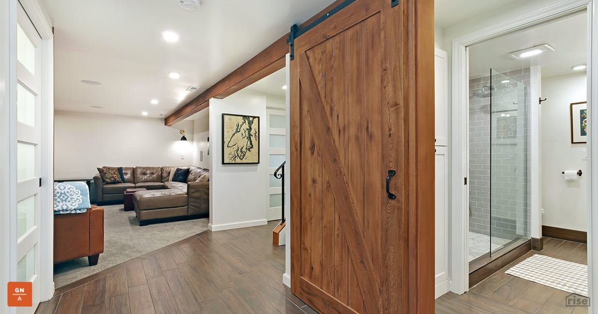 Hall with sliding wood door with Carpeting by Gant Nychay Architecture PLLC