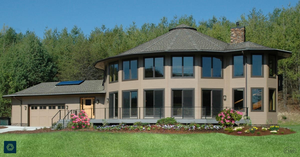 Roundhouse model with connected garage with Fixed Window by Deltec Homes