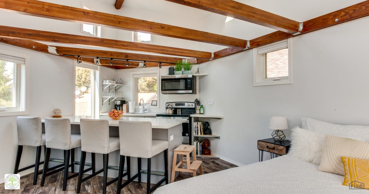 Triangle House with Ceiling Light by HARKA Architecture, LLC