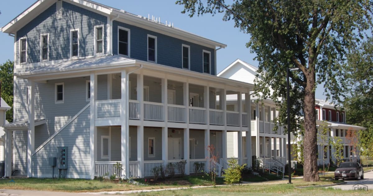 Row of multi-story townhomes with energy efficient windows with Triple ...