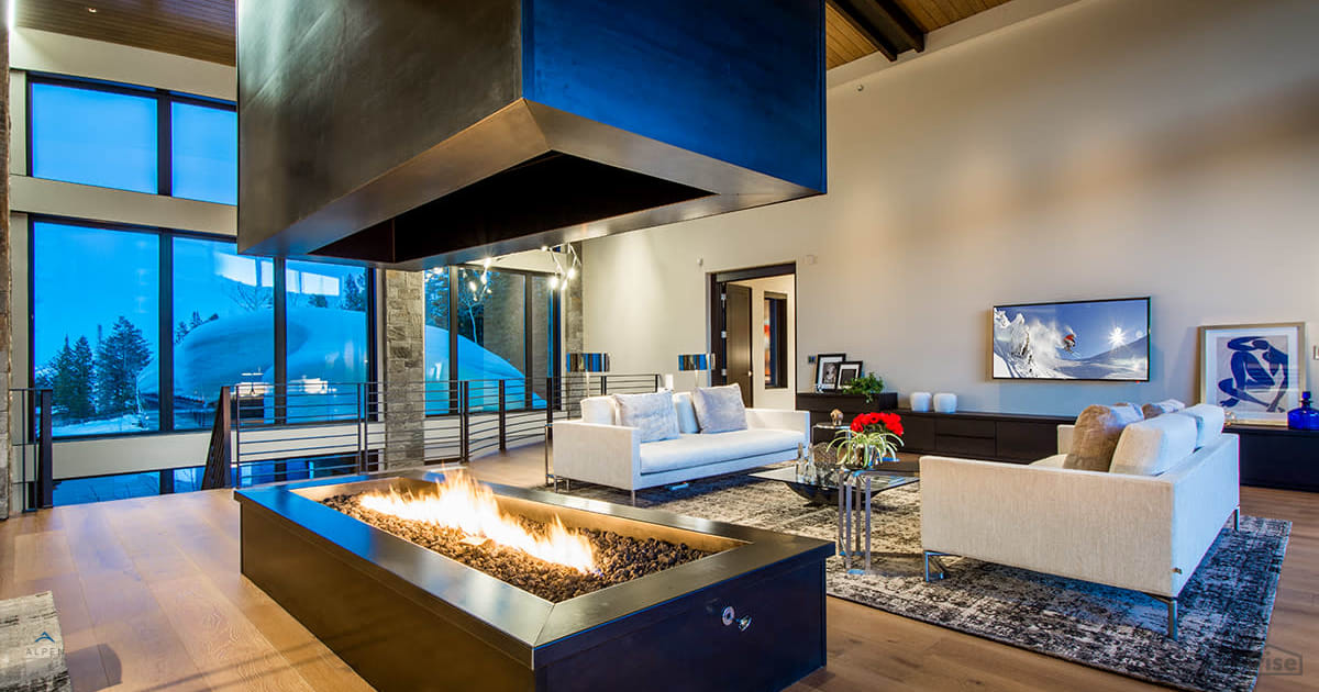 Living room with open fireplace and a wall of windows with Integrated ...