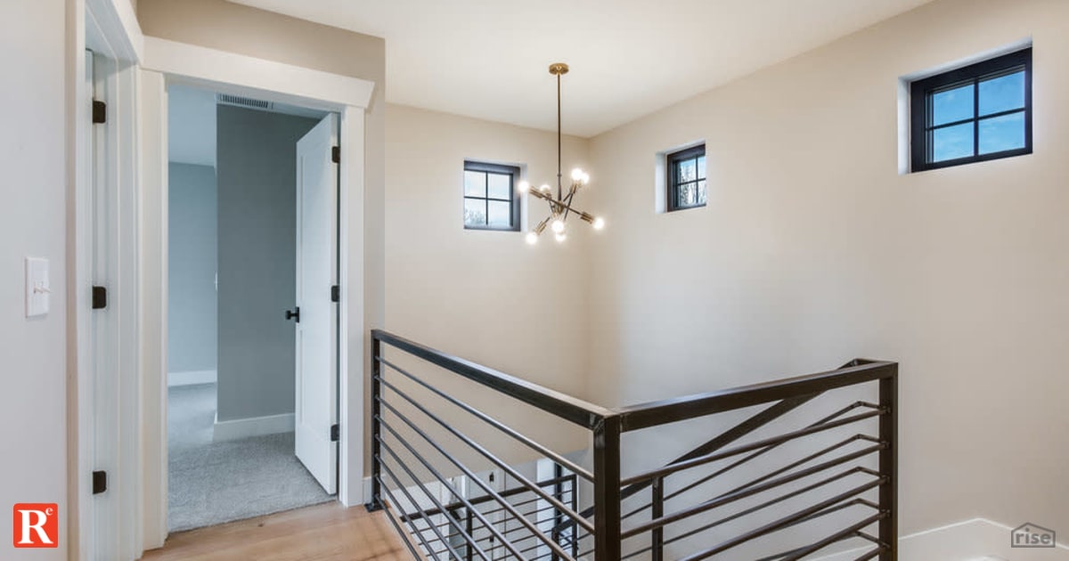 Staircase with feature lighting with Fixed Window by Revolve Design Build