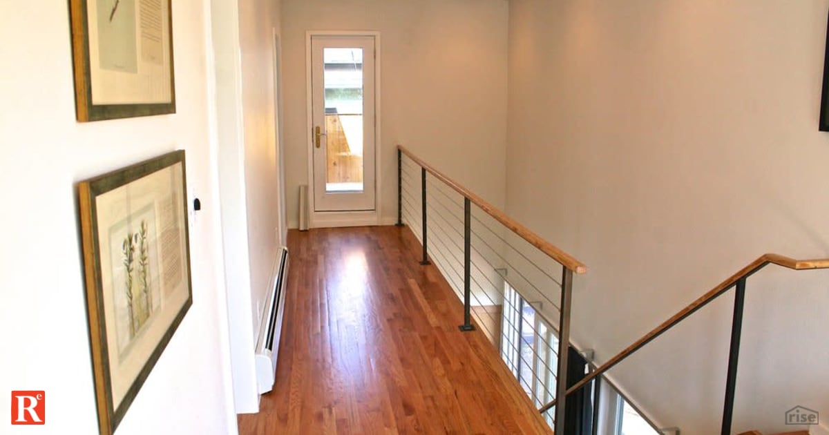 Upstairs hallway with staircase with Energy Star Exterior Door by ...