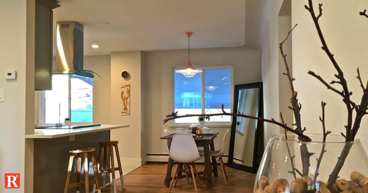 Open concept dining area with Induction Range by Revolve Design Build