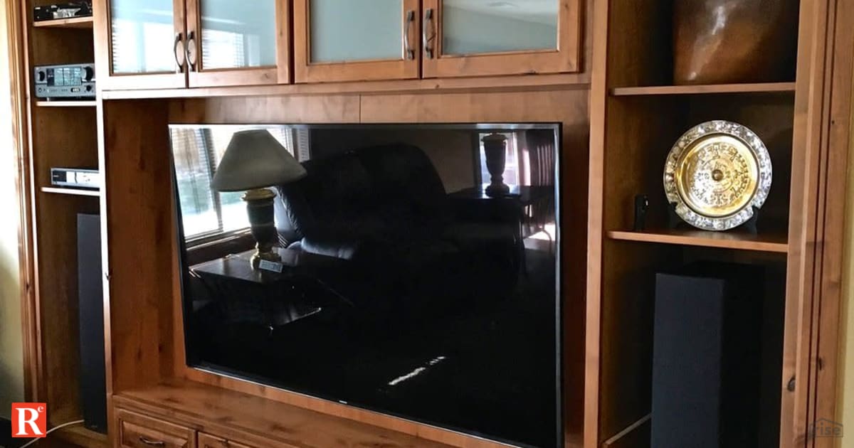 Custom entertainment console with Television by Revolve Design Build