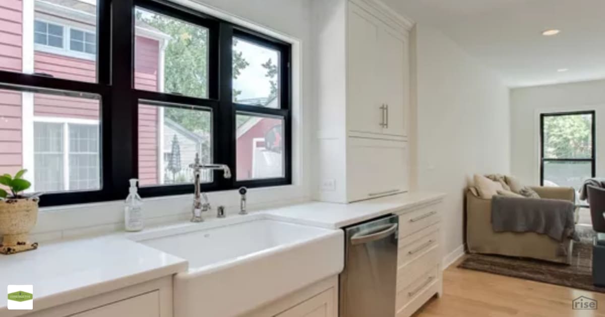 Kitchen with Low-Flow Kitchen Faucet by Constructive Builders