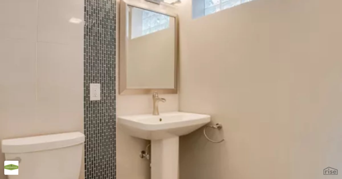 Bathroom with Dual Flush Toilet by Constructive Builders
