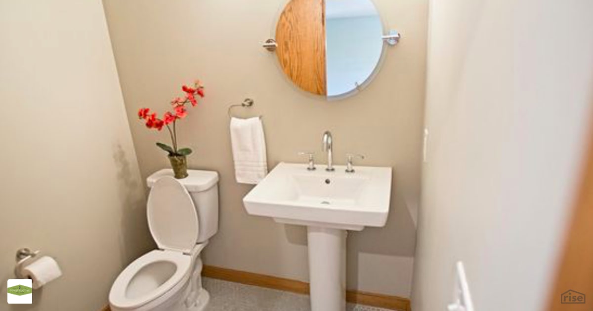 Bathroom with Low-Flow Bathroom Faucet by Constructive Builders