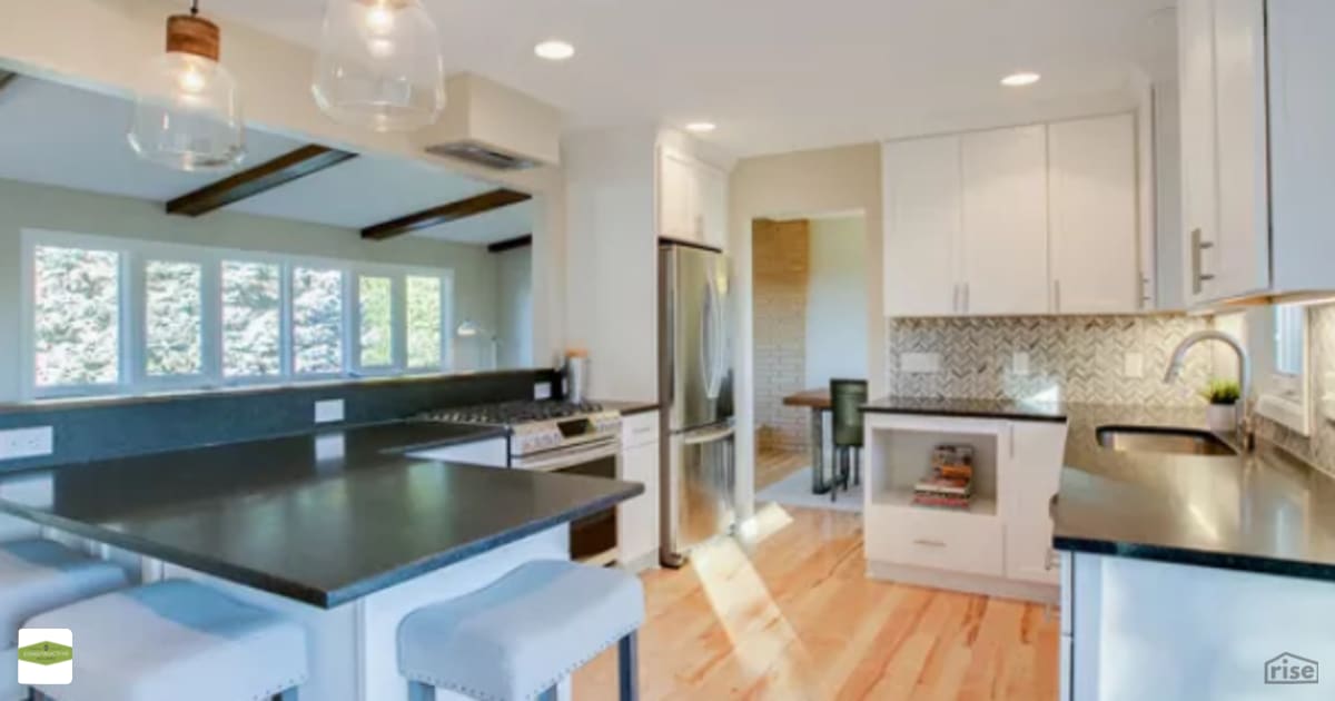 Kitchen with Gas Range by Constructive Builders