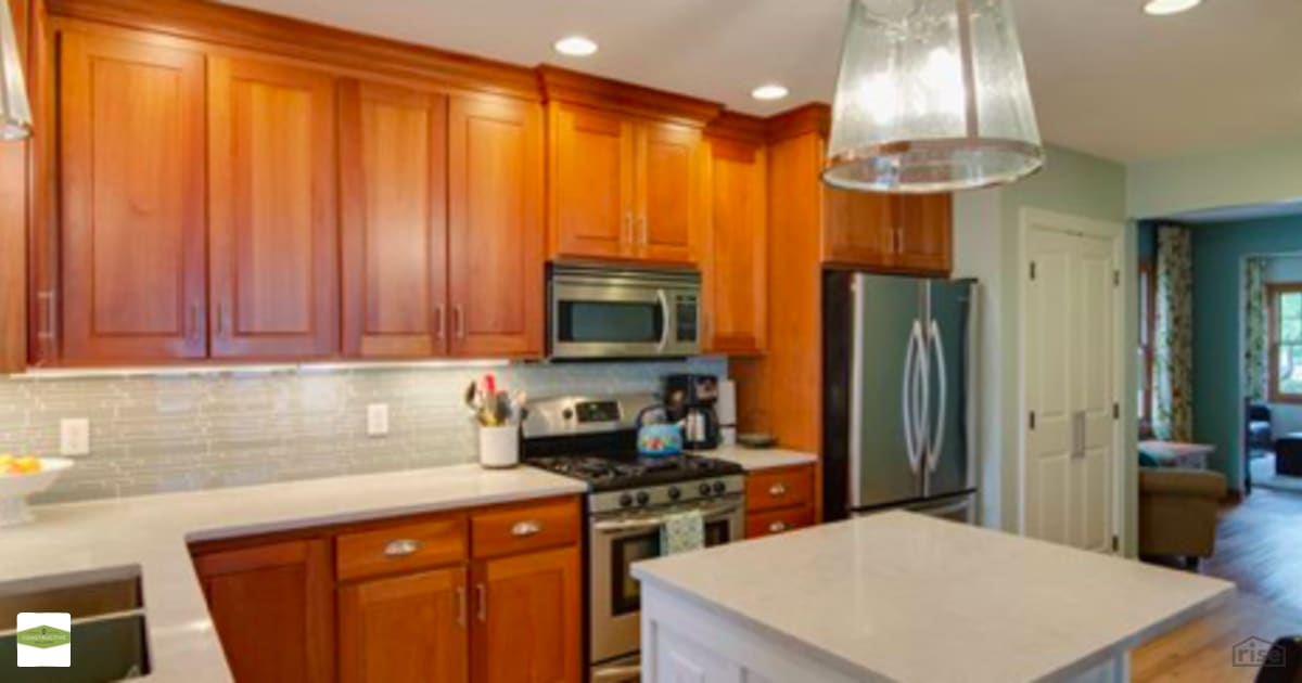 Kitchen with Gas Range by Constructive Builders