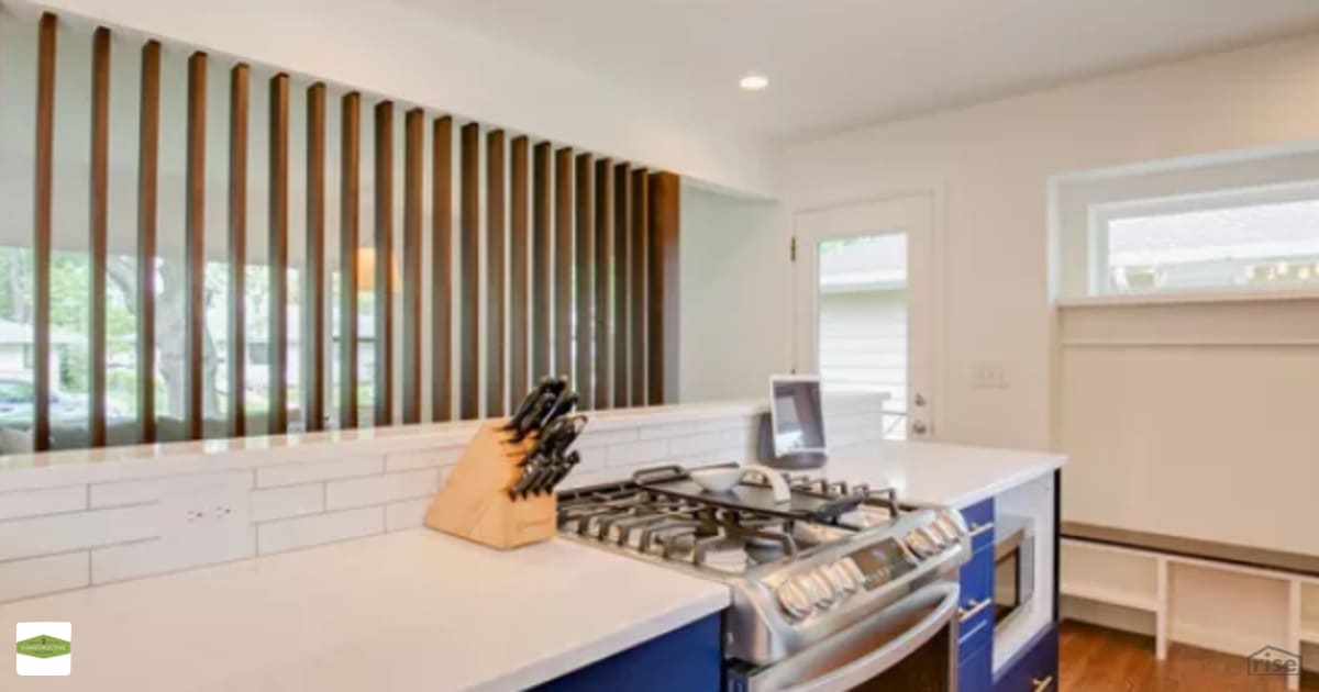 Kitchen with Gas Range by Constructive Builders