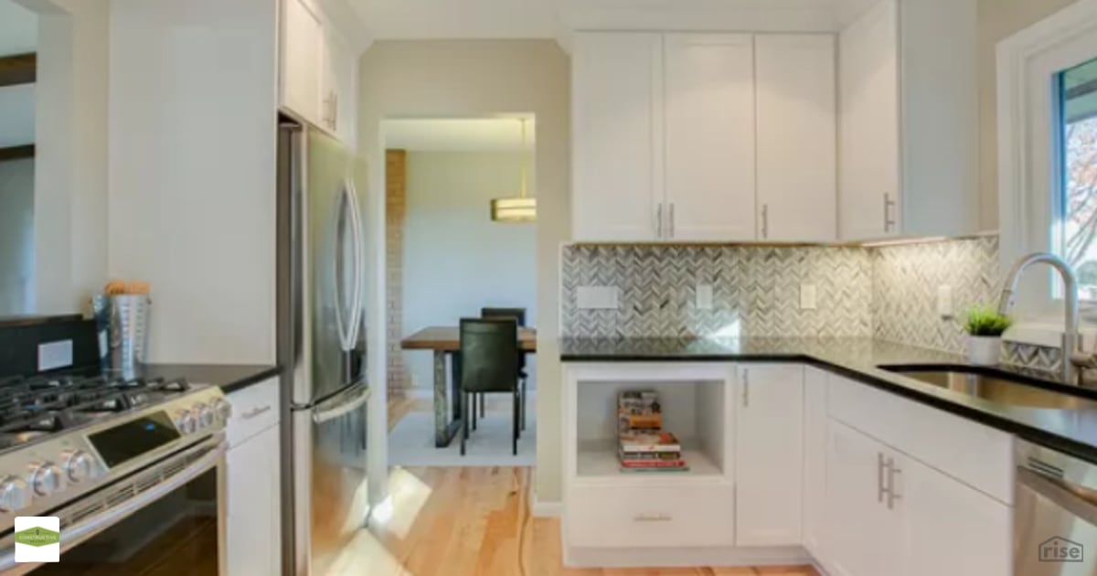 Kitchen with Gas Range by Constructive Builders