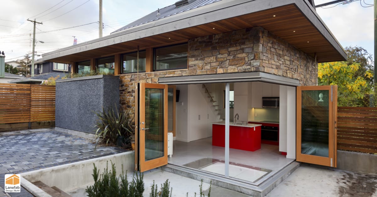 Slocan exterior patio and open doors with Concrete Flooring by Lanefab ...