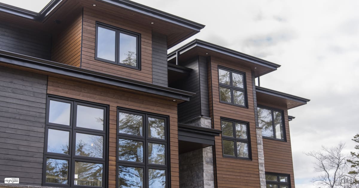 Bridge Over Water - Exterior with Brick Siding by Homes by Highgate