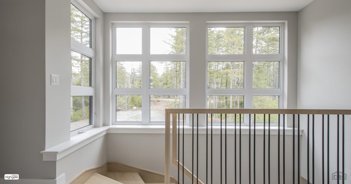Bridge Over Water - Staircase with Fixed Window by Homes by Highgate