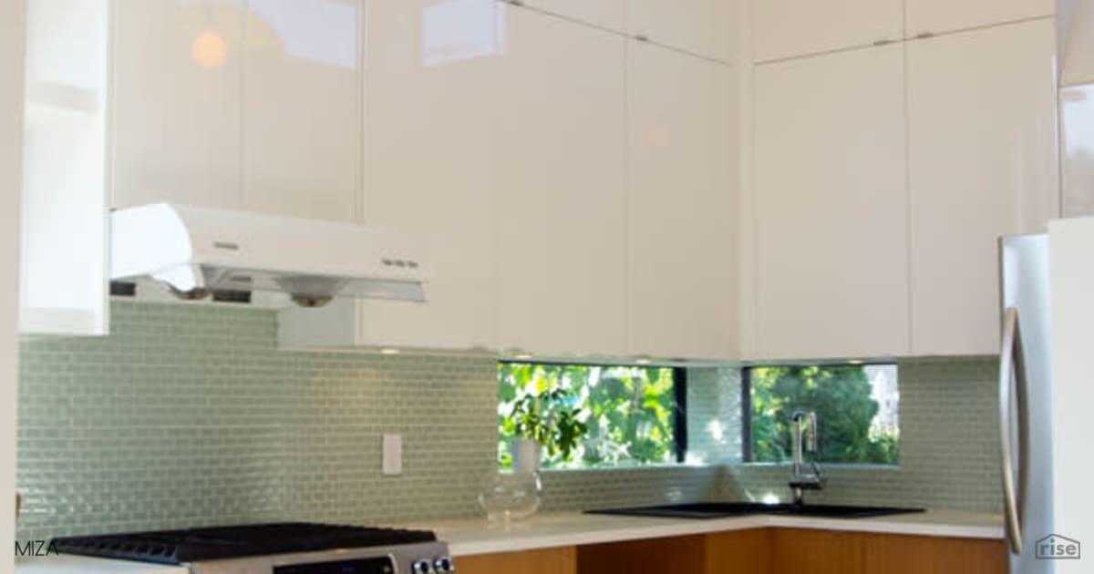 Kitchen with Aluminum or Metal Window Frame by MIZA Architects