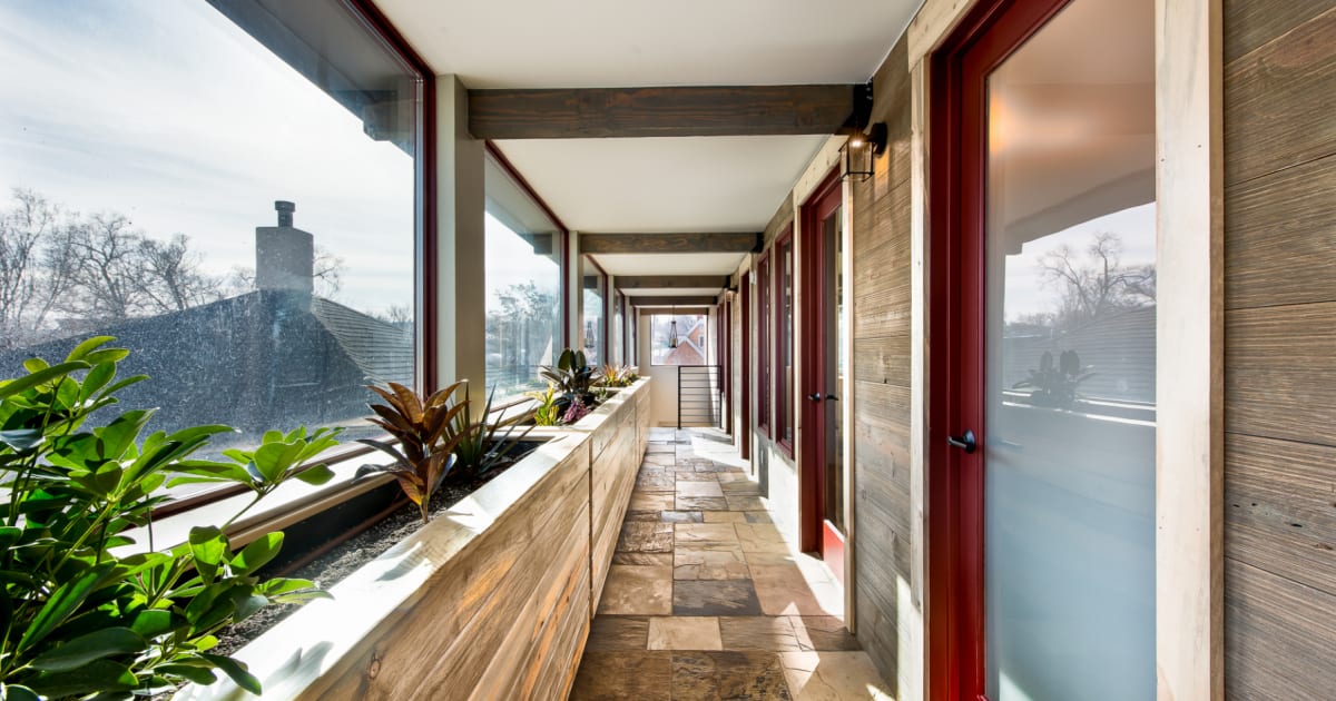 Rise | Window-lined hallway with Wall Mounted Outdoor Lighting by Alpen ...