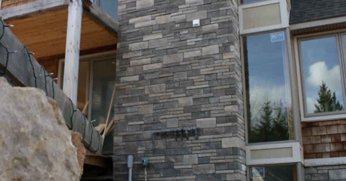 Stone chimney with Stone Siding by Masonal Stone Inc