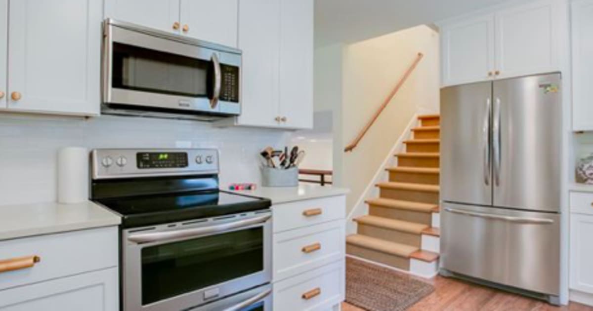 Rise | Kitchen with Laminate Flooring by Constructive Builders