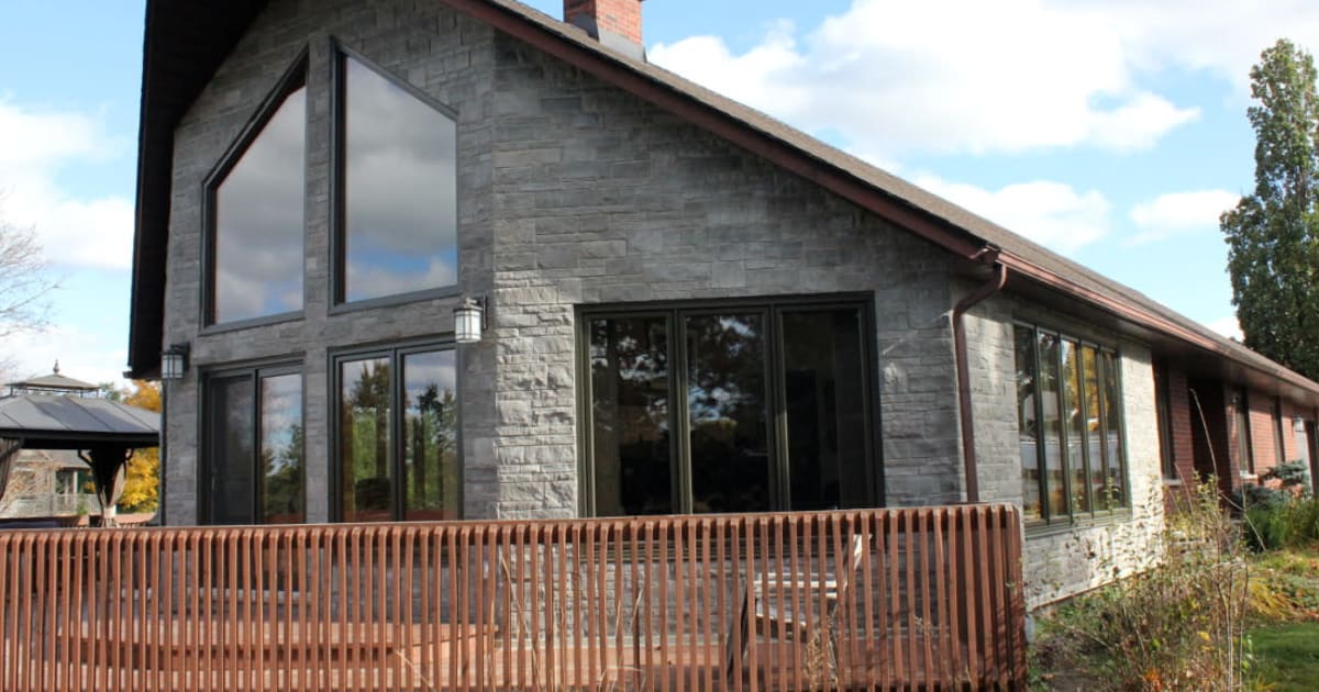 Rise | Stone and brick sided home with Accent Outdoor Lighting by ...