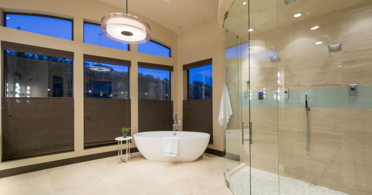 Rise | Large shower with soaker tub surrounded by windows with ...