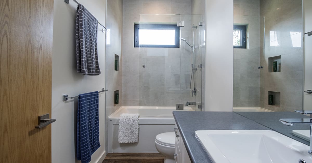 Rise | Bathroom with Low-Flow Bathroom Faucet by Pheasant Hill Homes Ltd.