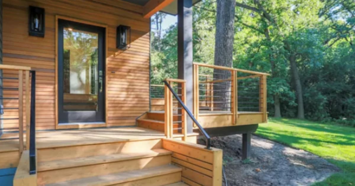 Front Door with Accent Outdoor Lighting by Constructive Builders