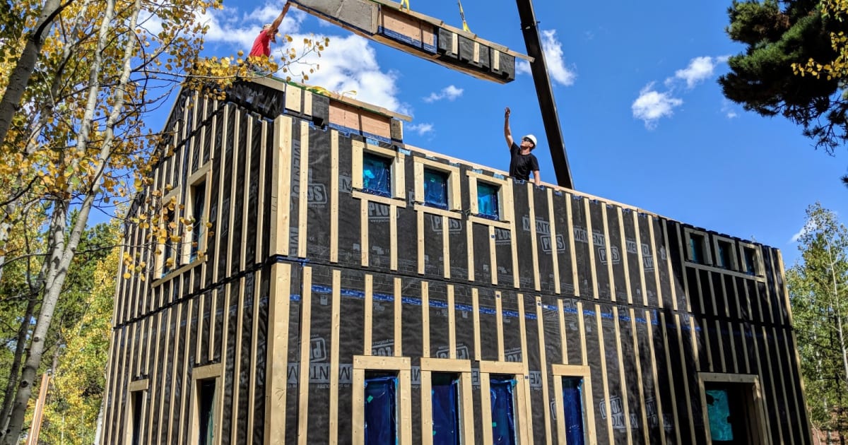 Rise | H15 panelized prefab passive house installing roof with ...
