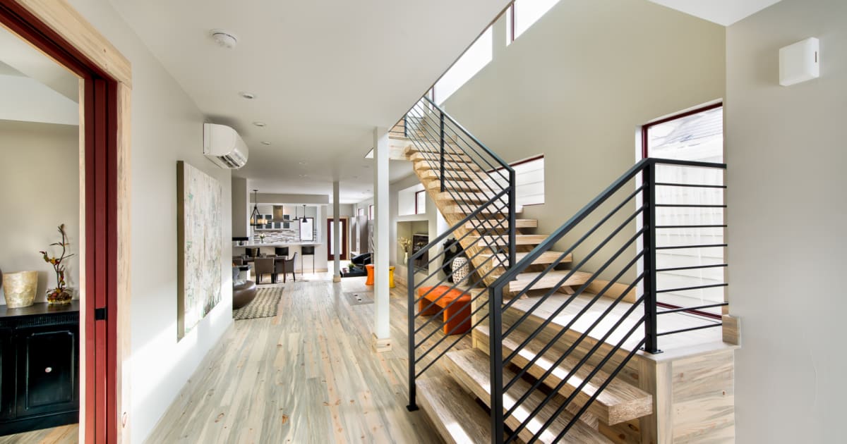 Rise | Entryway with floating wood staircase to second floor with FSC ...