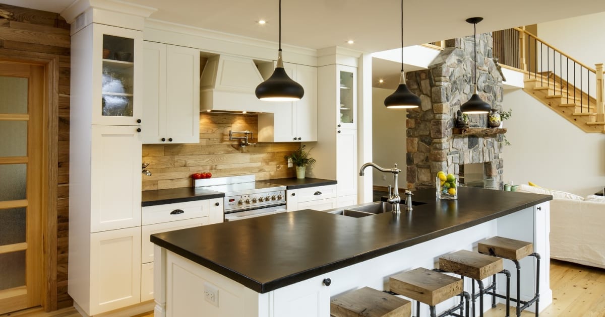 Red Castle Kitchen Island with Range Hood by The Conscious Builder