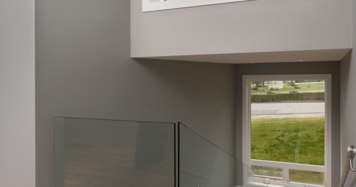 Rise | Staircase with Fixed Window by My House Design/Build Team Ltd.