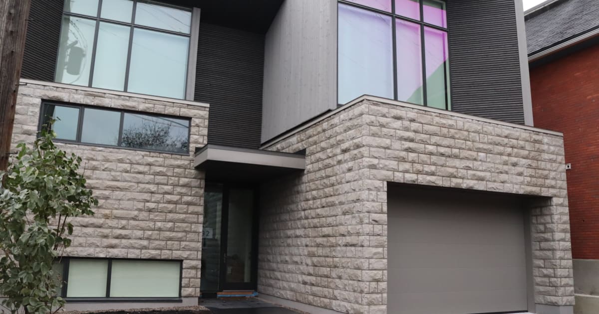 Modern stone sided house with Stone Siding by Masonal Stone Inc