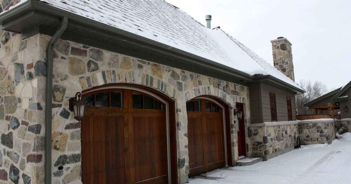 Rise | Double car garage with stone siding with Stone Siding by Masonal ...