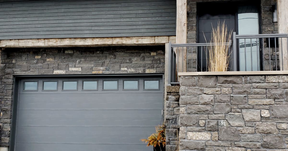 Rise | Stone sided garage with staircase to entryway with Clapboard ...