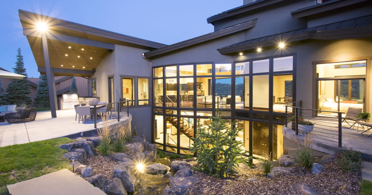 Rise | Rear patios and cascading 2-story courtyard with water feature ...
